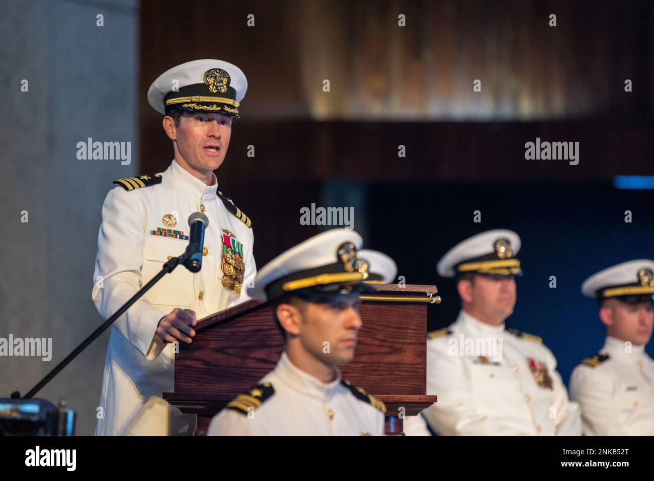 NAVAL BASE GUAM, Guam (Aug 12, 2022) – Cmdr. Thomas Dixon, left, gives ...