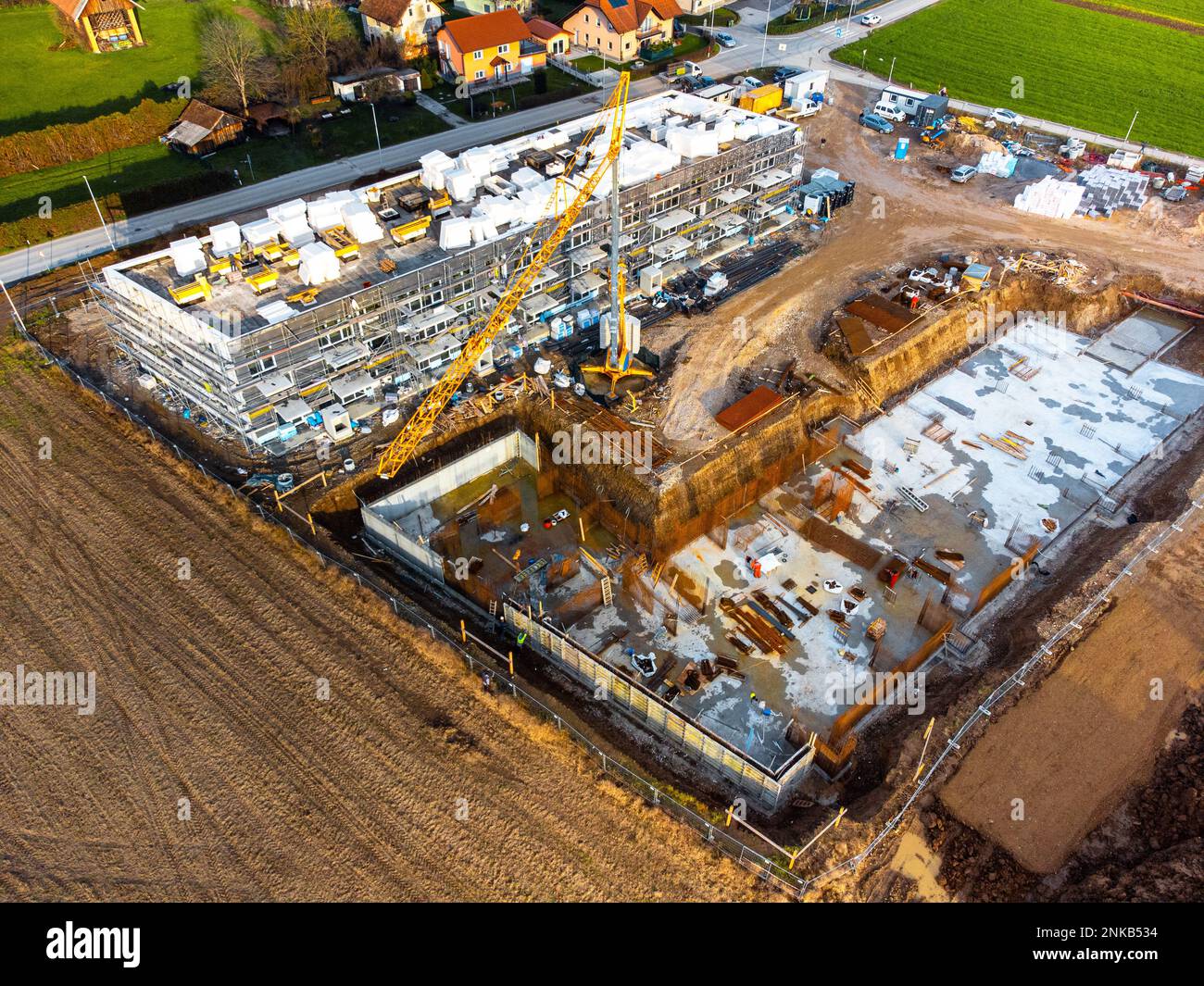 Two new apartment buildings under construction, one almost finished ...