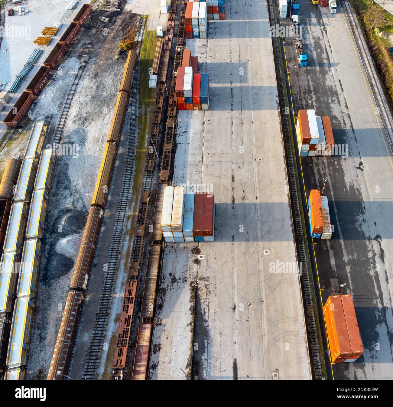 Freight depot with shipping containers and railroad tracks Stock Photo - Alamy