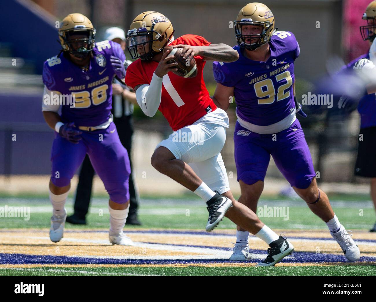 James Madison quarterback Todd Centeio (1) bursts through a gap in the ...