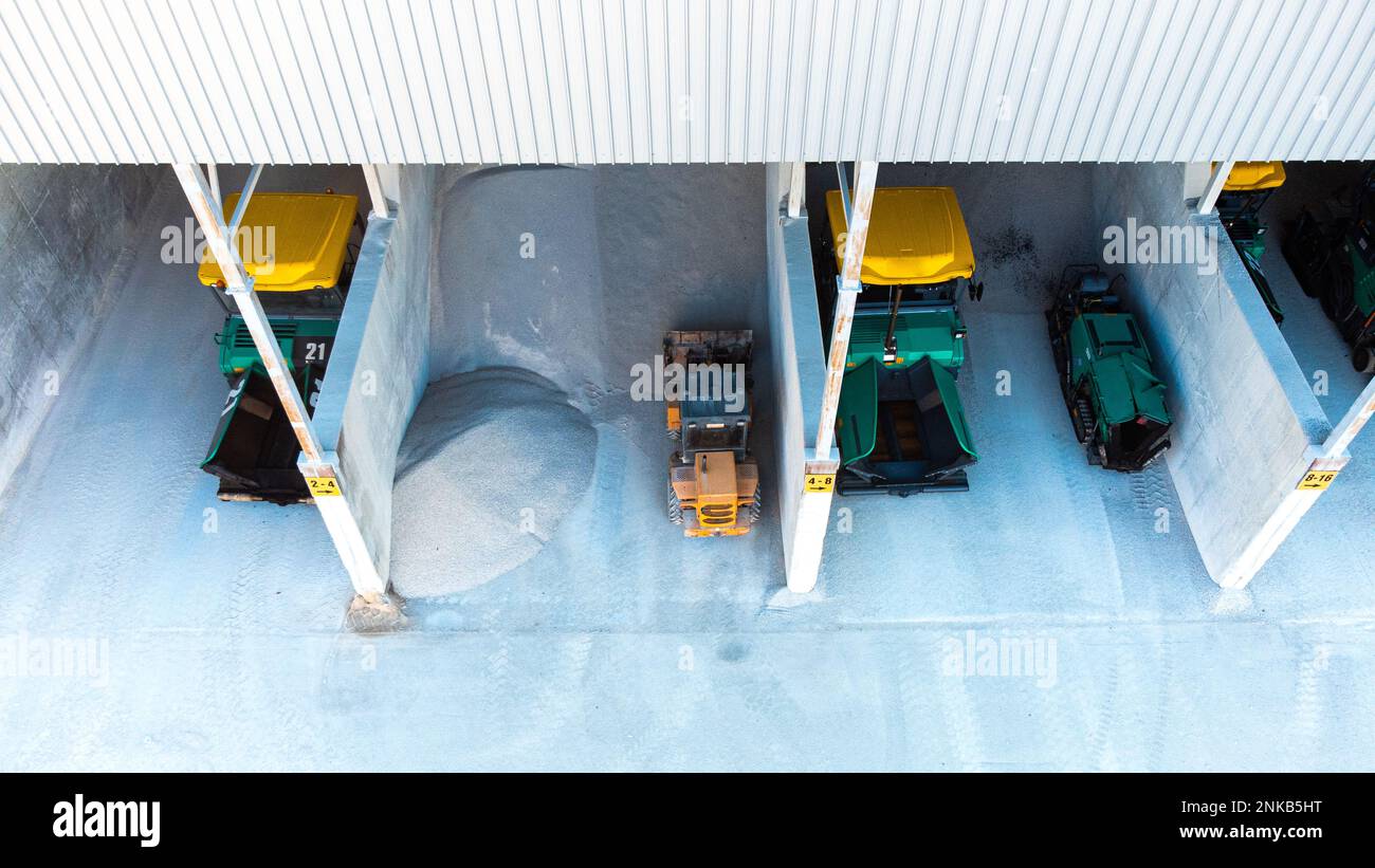 Asphalt plant garage for heavy machinery, aerial view Stock Photo - Alamy