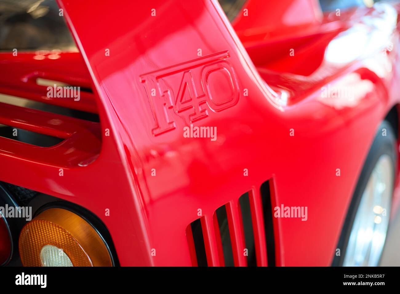 Ferrari F40 logo on the rear spoiler. Shallow depth of field.Series of ...