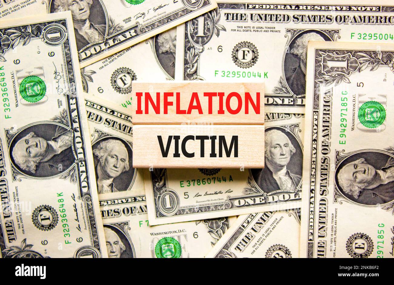 Inflation victim symbol. Concept words Inflation victim on wooden block ...
