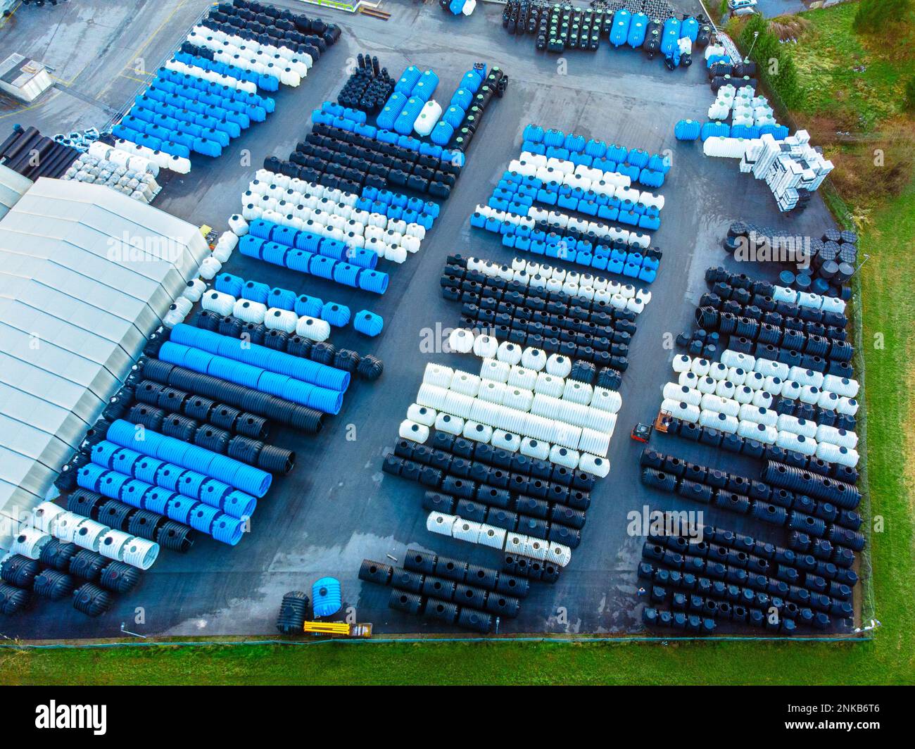 Industrial outdoor plastic pipes and bulk goods warehouse aerial view ...