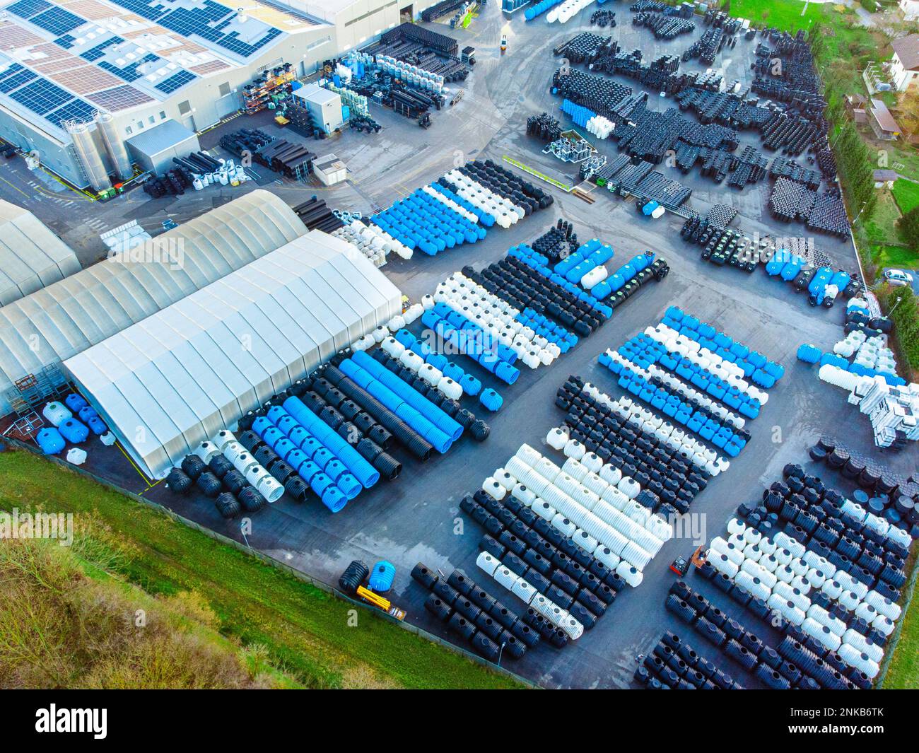Industrial outdoor plastic pipes and bulk goods warehouse aerial view ...