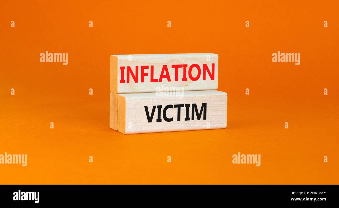 Inflation victim symbol. Concept words Inflation victim on wooden block ...