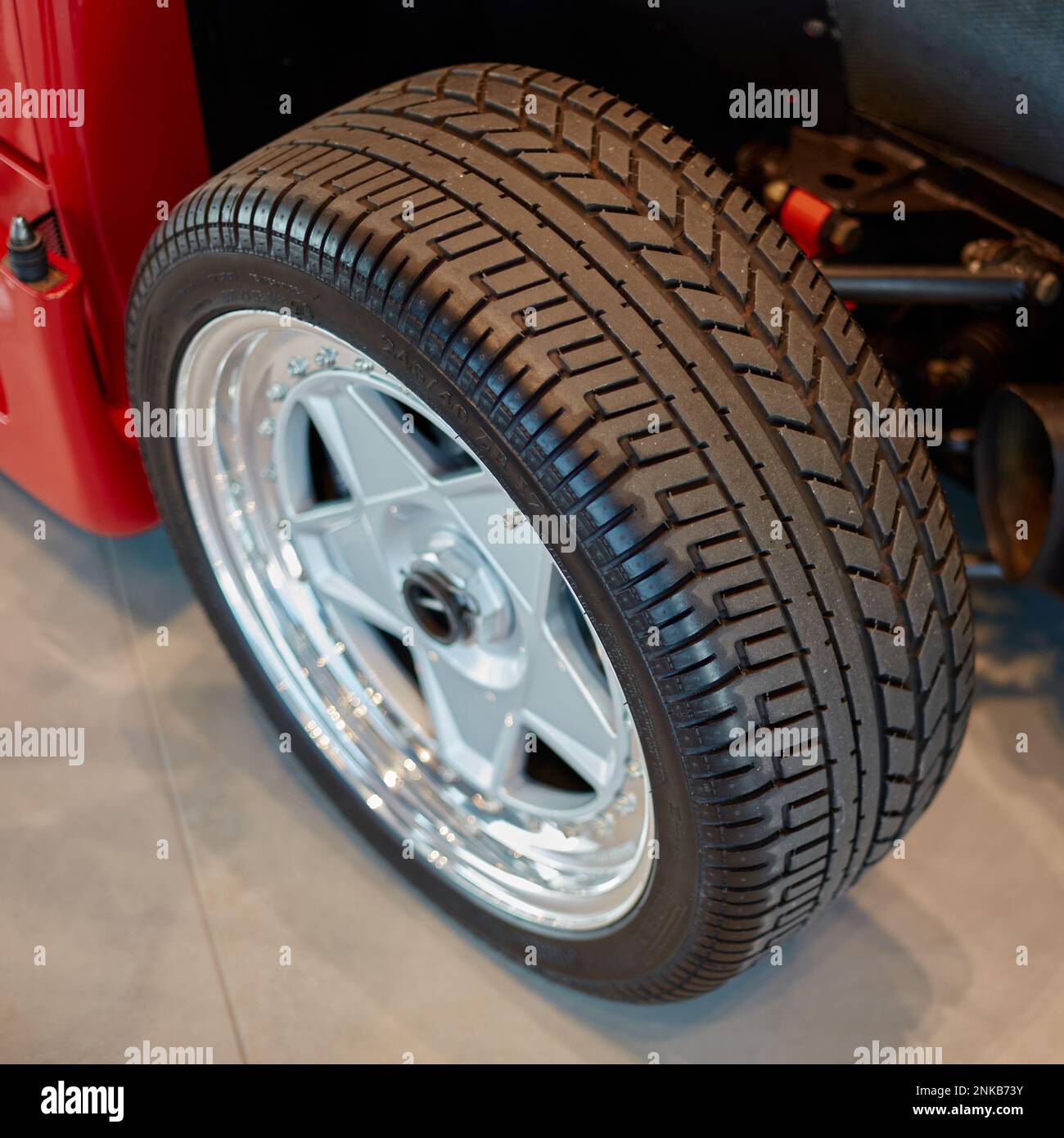 The wheel of Ferrari F40 (tire 245-40 ZR 17) after professional ...