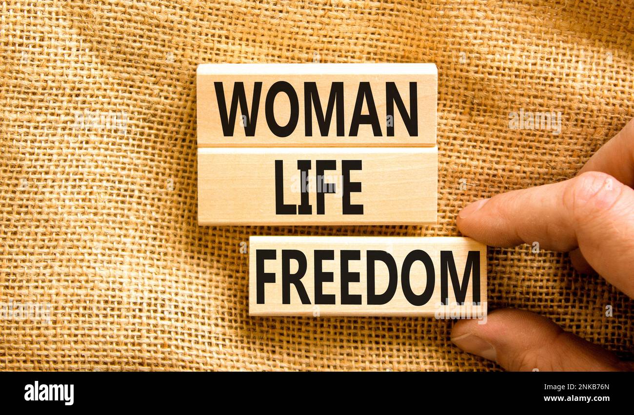 Woman life freedom symbol. Concept words Woman Life Freedom on wooden ...