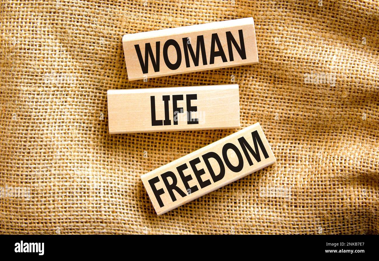 Woman life freedom symbol. Concept words Woman Life Freedom on wooden ...