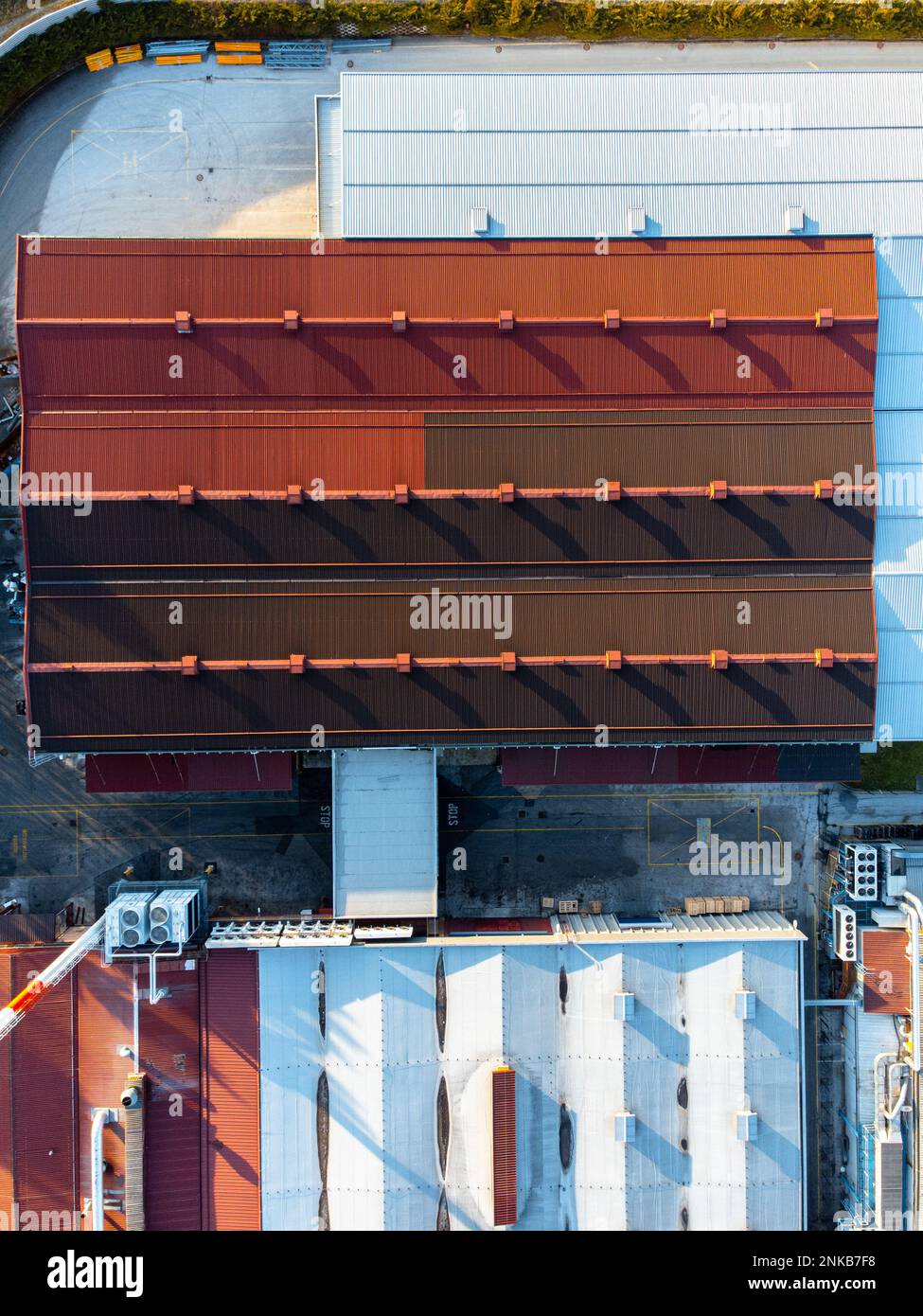 Top down view of a warehouse with a red roof, industrial site Stock ...