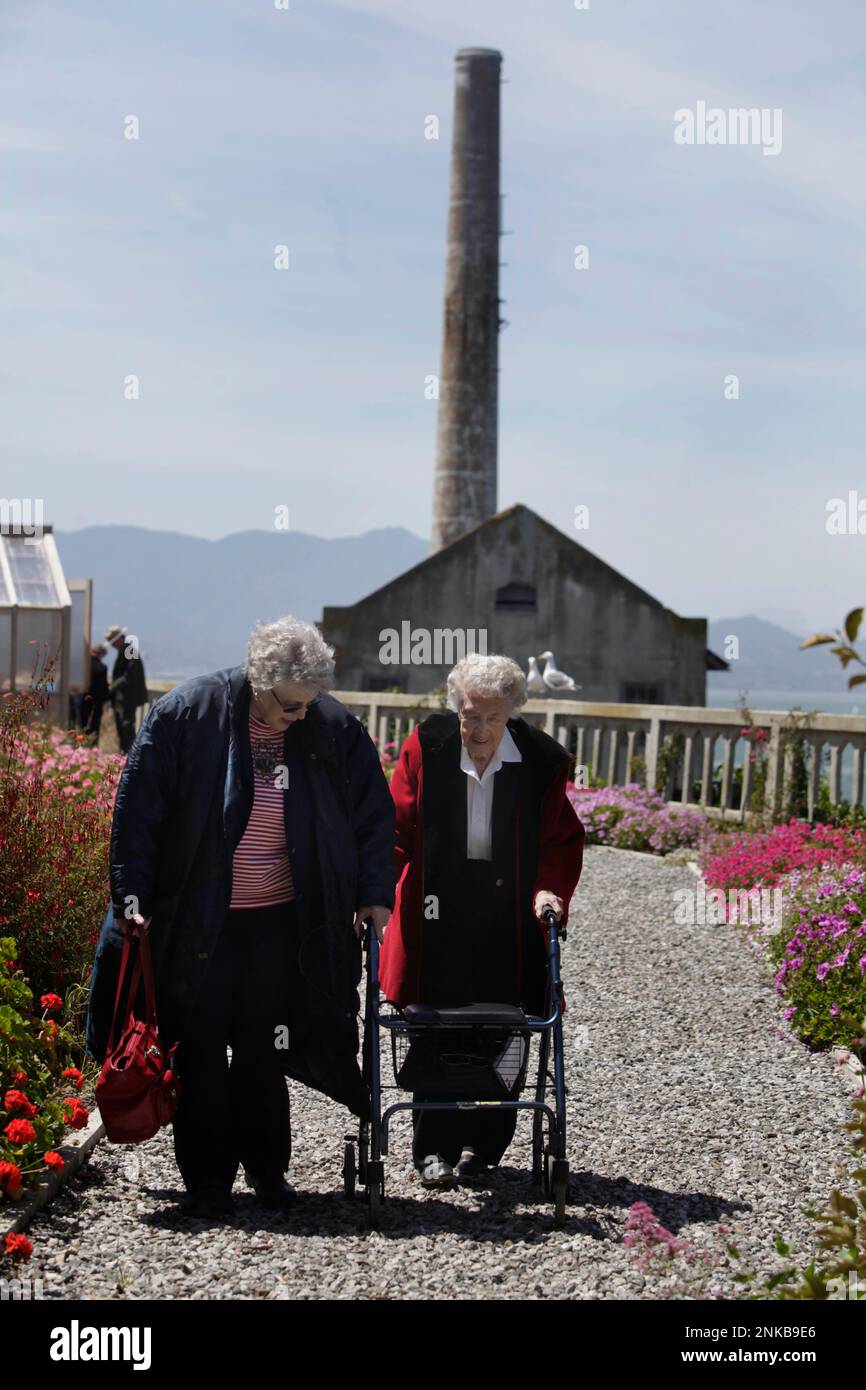 Betty Lou Vickery (right) and her daughter Sandy Barron walk together ...