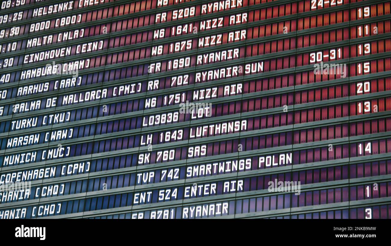 Departures board at an international airport terminal with European ...