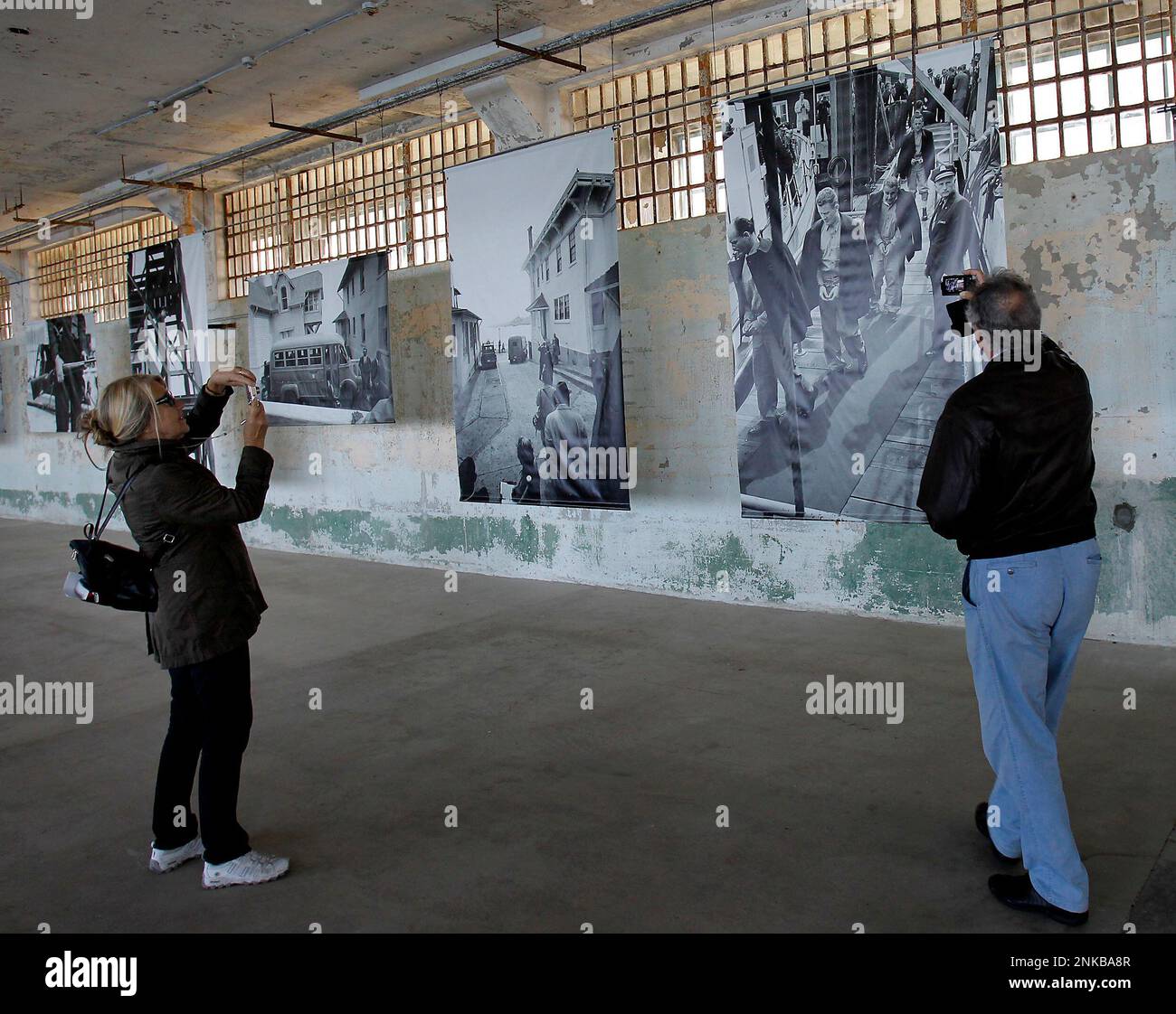 Visitors photograph the large images from the prisons last day ...