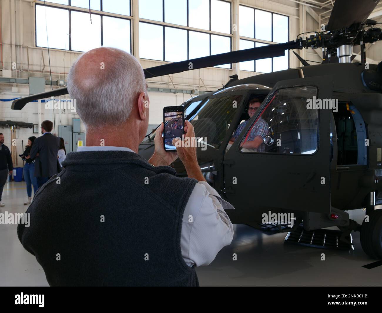Ohio state Rep. Timothy E. Ginther takes photo of a legislative staff ...