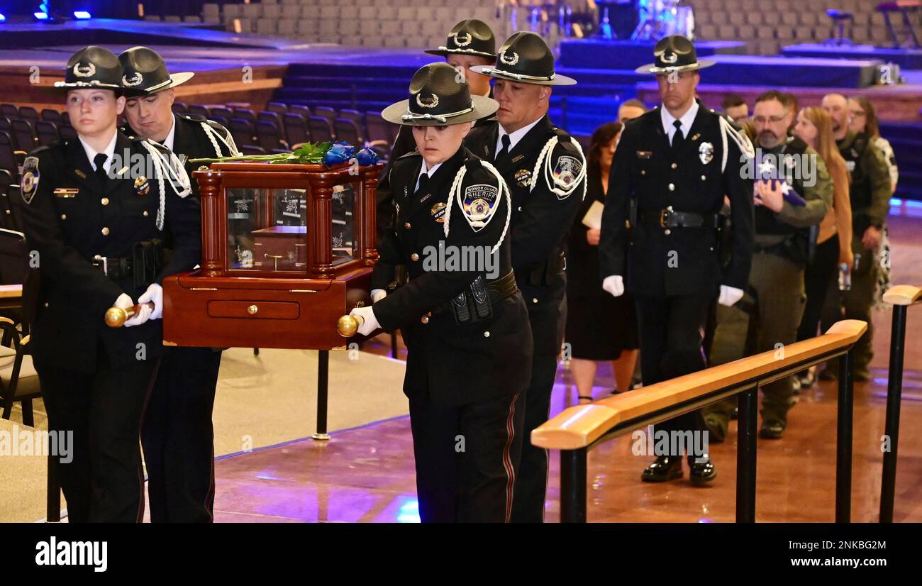 The remains of Jinx, a K9 police dog, are carried by an honor guard ...