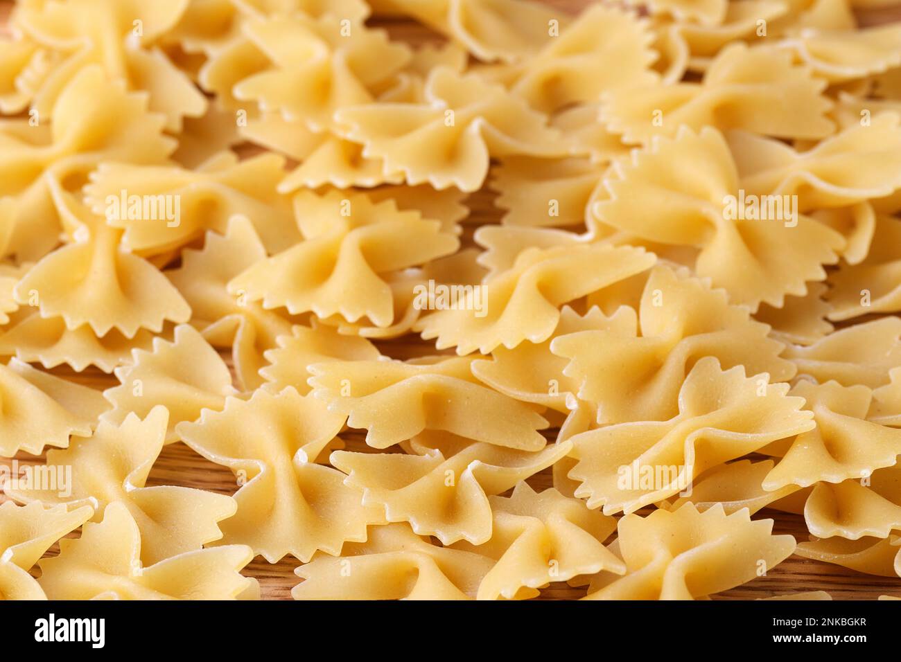 Authentic pasta background in the form of bows. Close-up. Selective ...