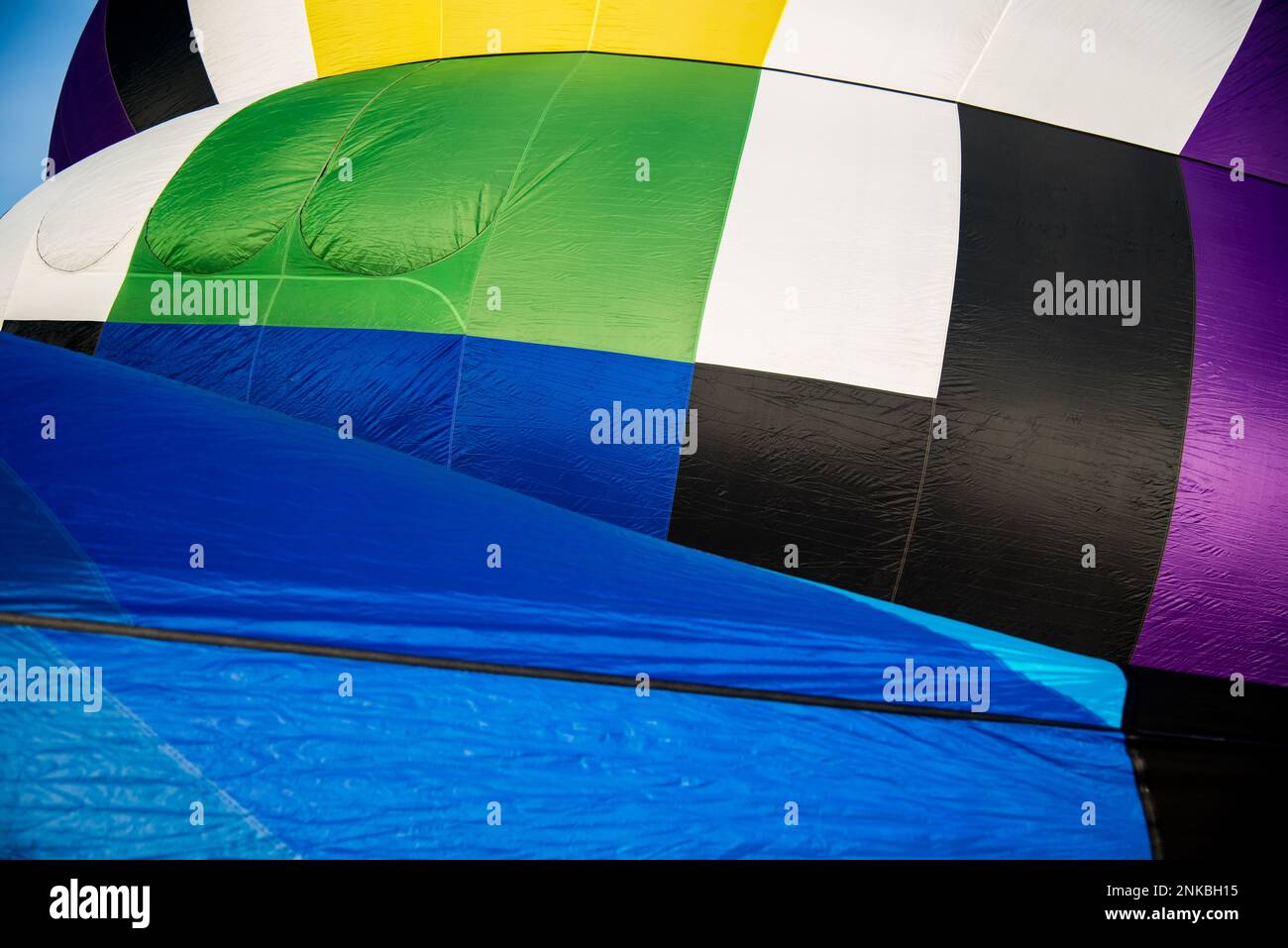 Bold and garish colors and patterns of hot air balloons Stock Photo - Alamy