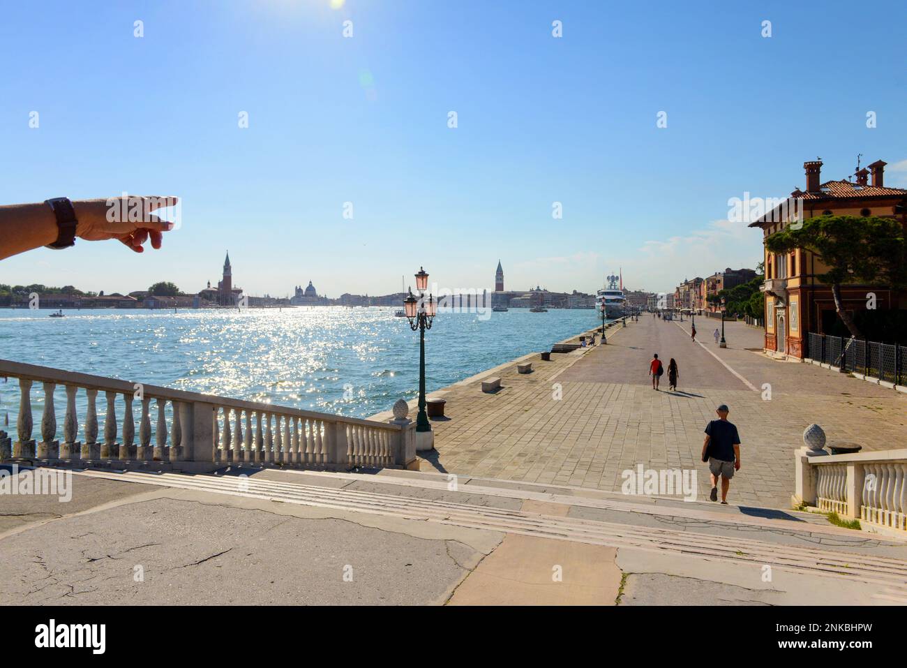 View of street at the Grand Canal on a hot summer morning. Blue sky ...