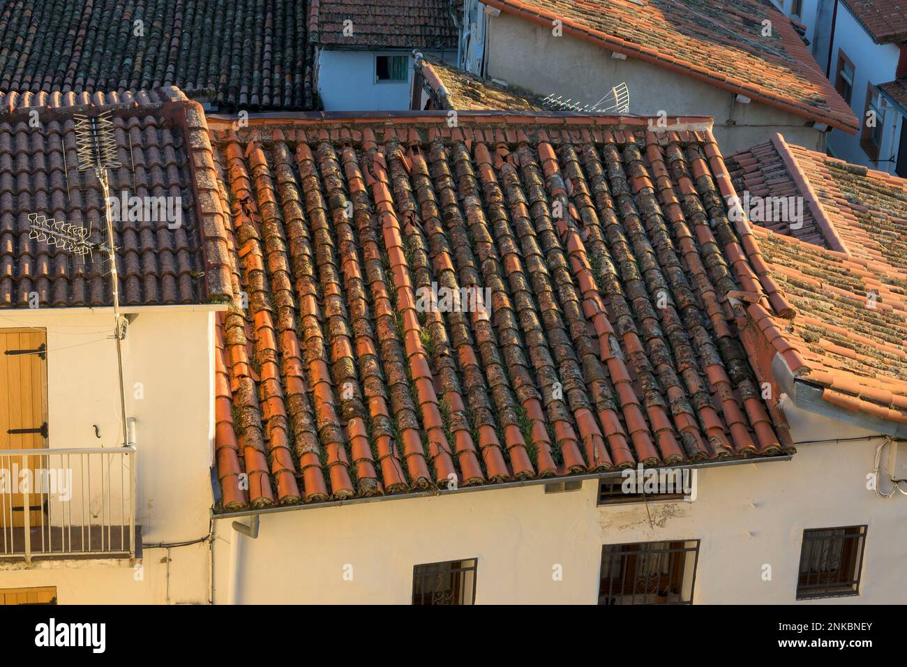 Old roof with broken red tiles in need of repair to avoid horizontal ... Old roof with broken red tiles in need of repair to avoid horizontal ...