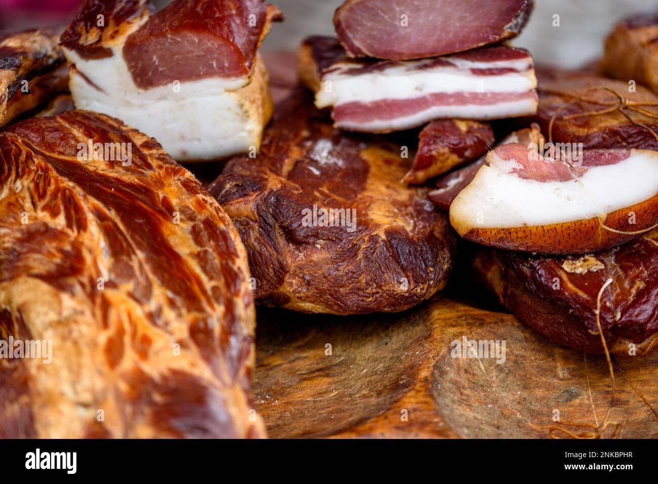 Domestic traditional smoked meat products a table produced Stock Photo ...