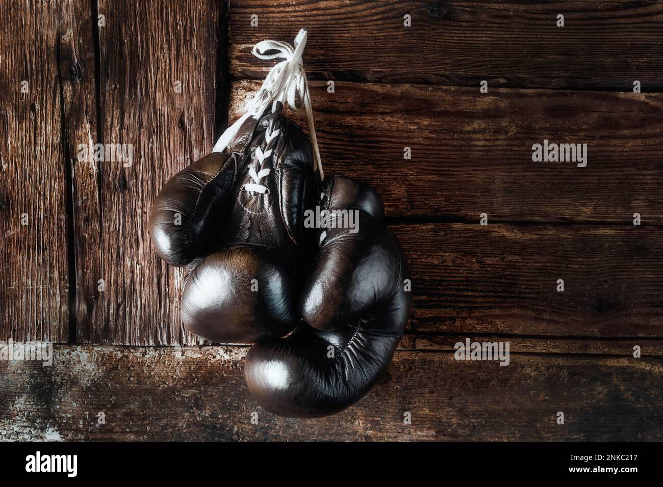 Old boxing gloves hanging hi-res stock photography and images - Alamy