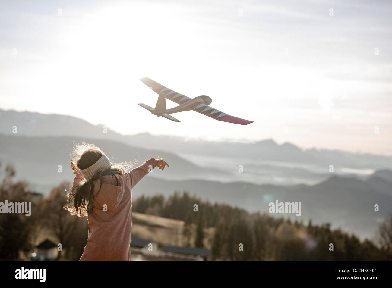Girl playing with model glider Stock Photo - Alamy