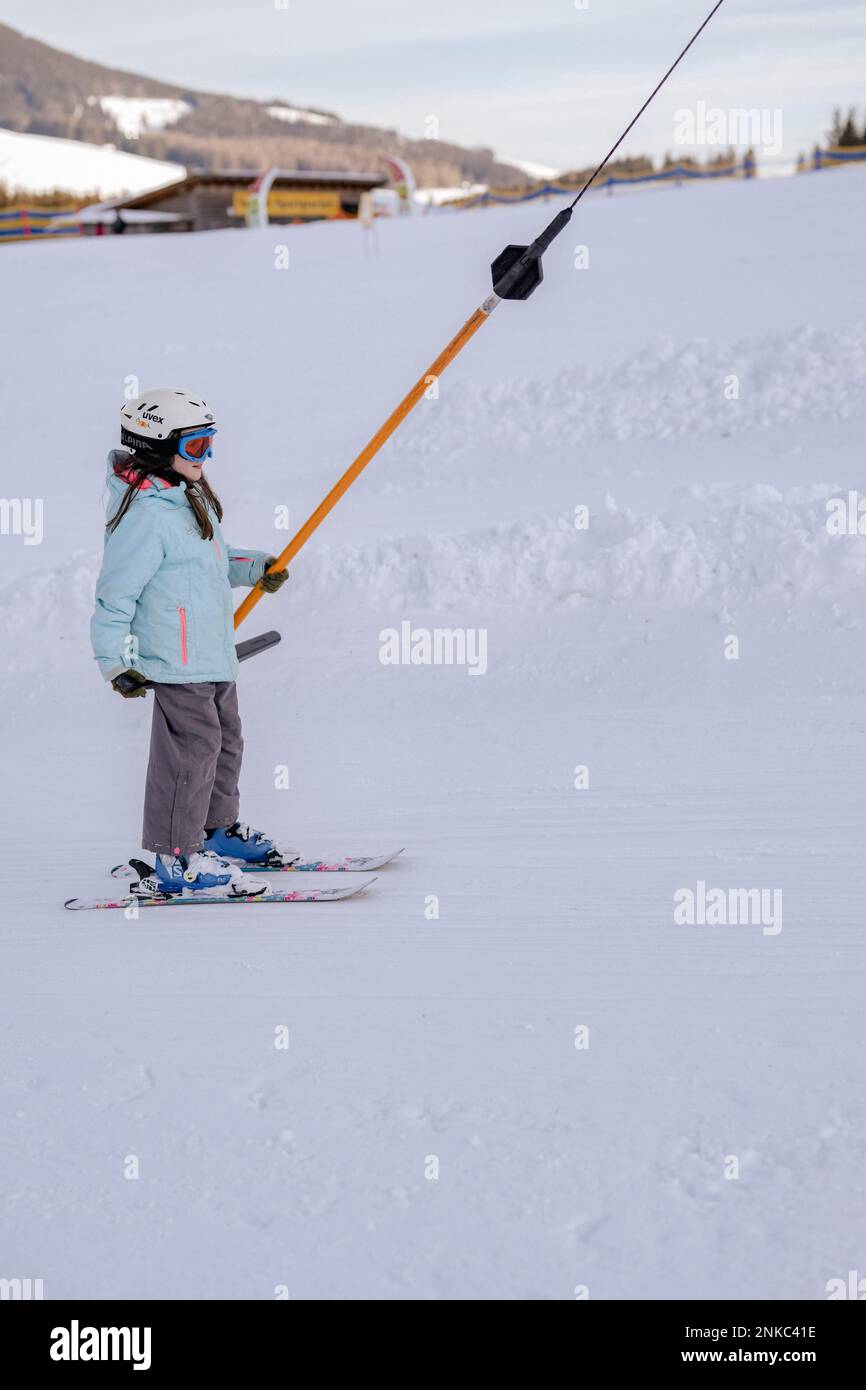 Girl rides drag lift Stock Photo - Alamy