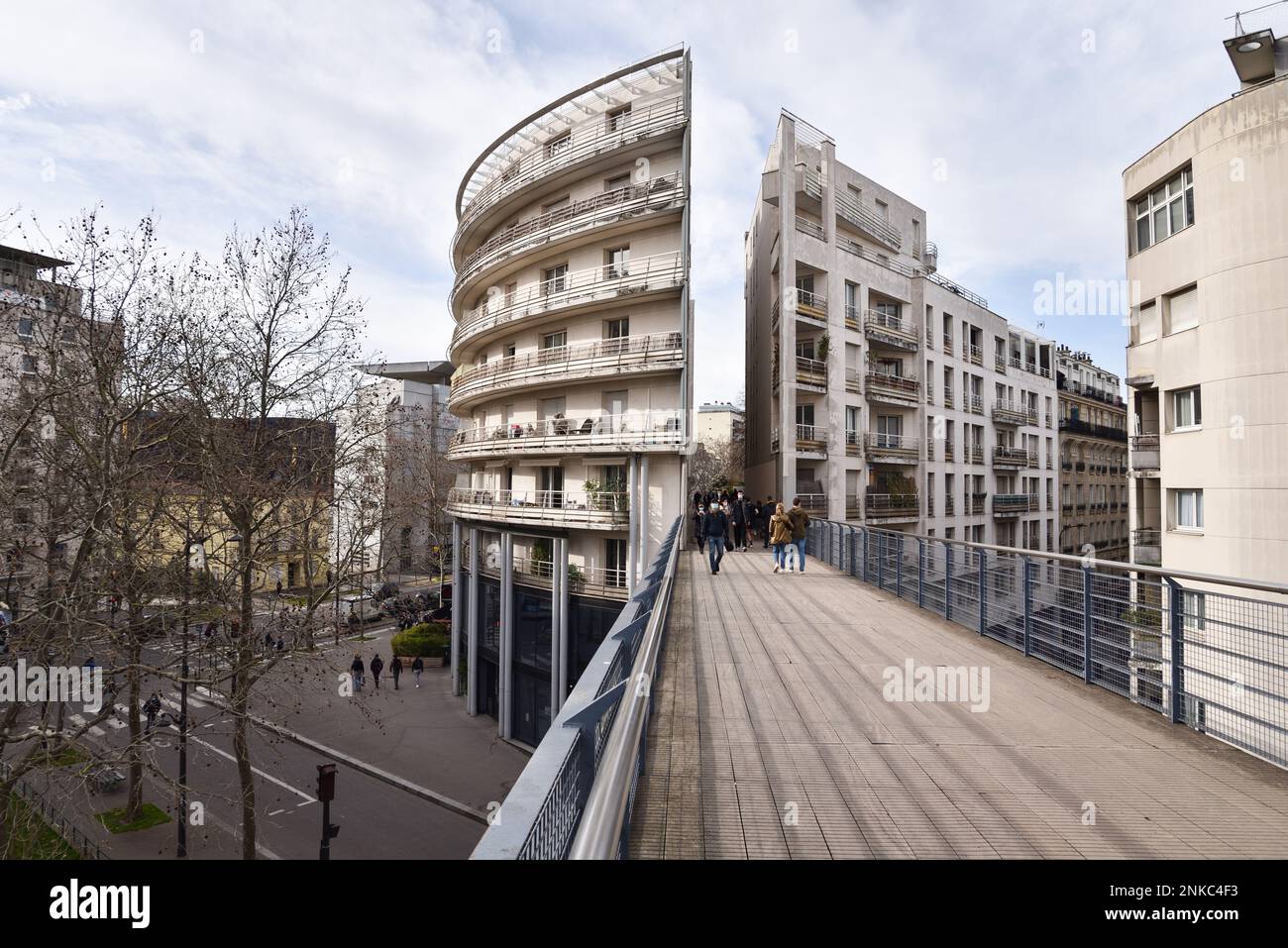 Coulée Verte René-Dumont Walkway Bridge Splitting Apartment Buildings ...
