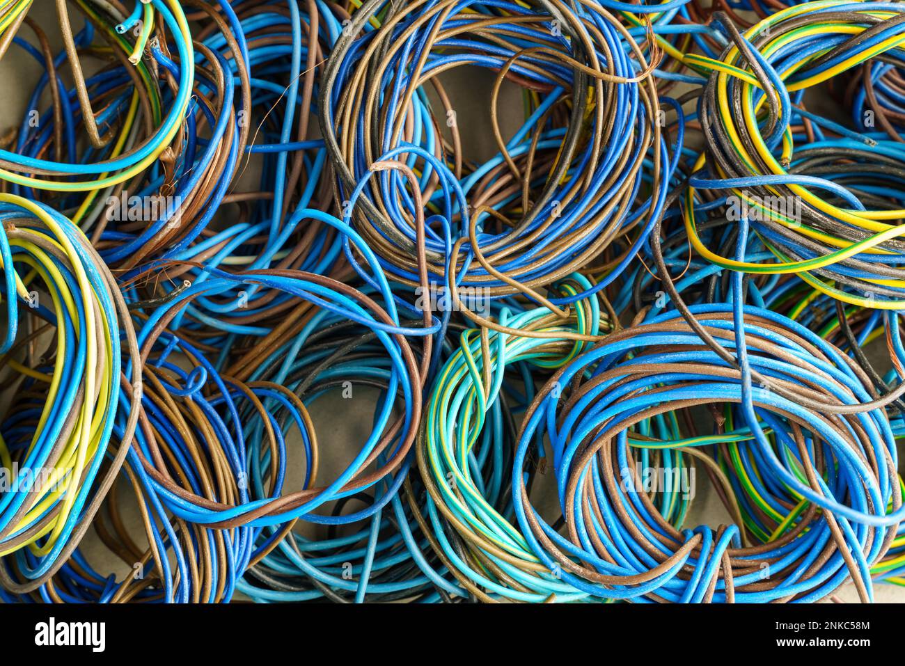 Colorful, coiled copper cables in rubber sheaths. Prepared for further ...