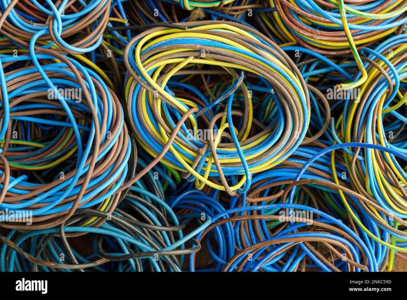 Colorful, coiled copper cables in rubber sheaths. Prepared for further ...