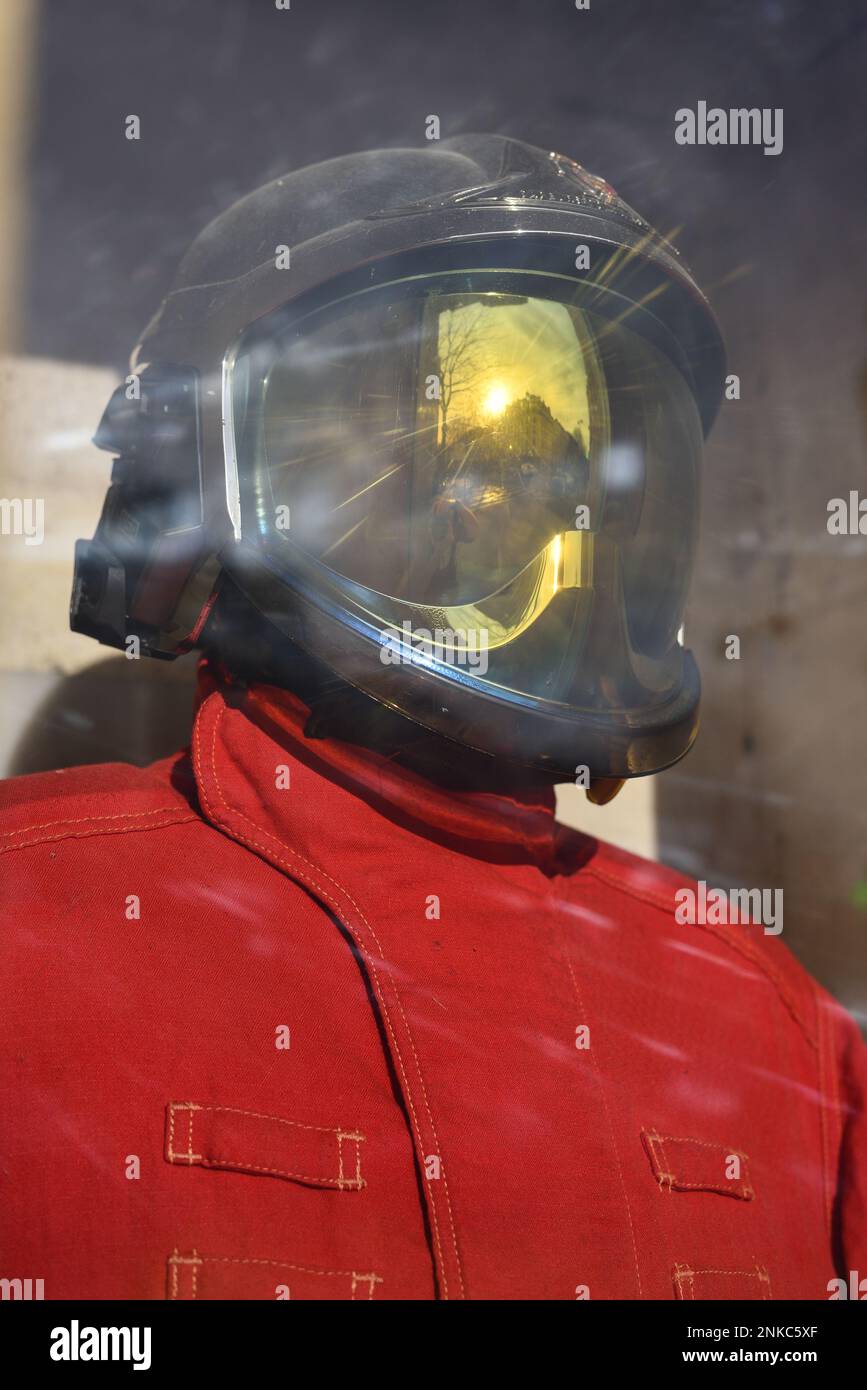 Firefighter Mannequin with Uniform and Golden Visor Helmet Stock Photo ...
