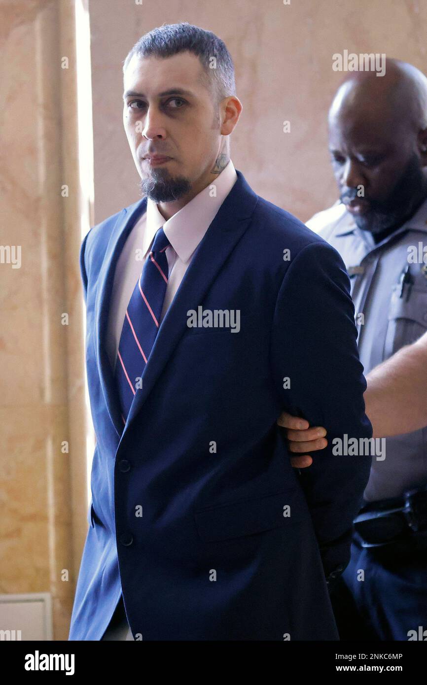 David Ware is led to a courtroom by Tulsa County Sheriff's deputies at ...
