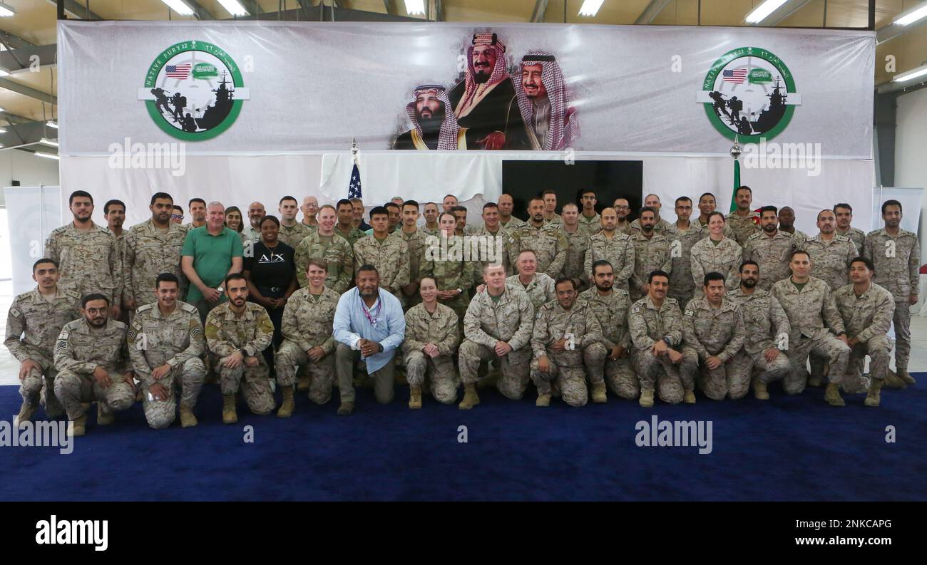 U.S. service members and Saudi Arabian Armed Forces members take a group photo during exercise ...