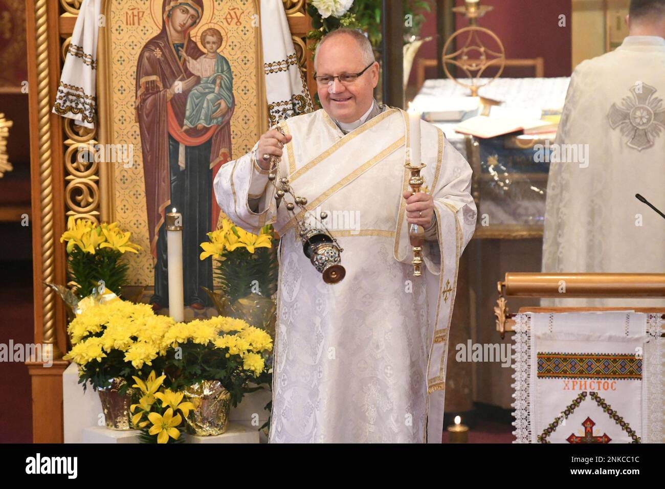 Father Deacon Paul Spotts swings a thurible during the Divine Liturgy ...