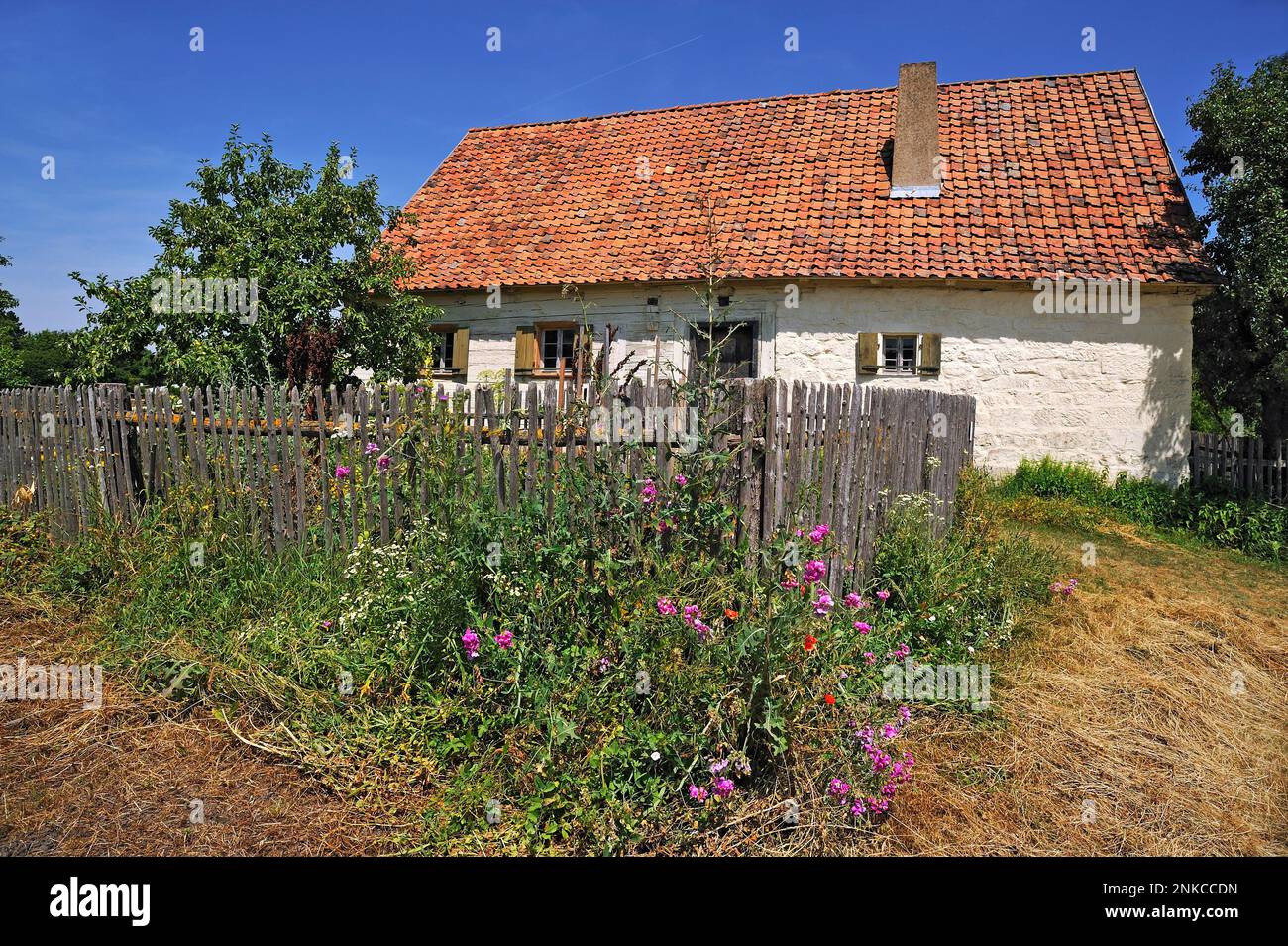 Farmhouse, built in 1711, in front a farm garden with fence, Franconian ...