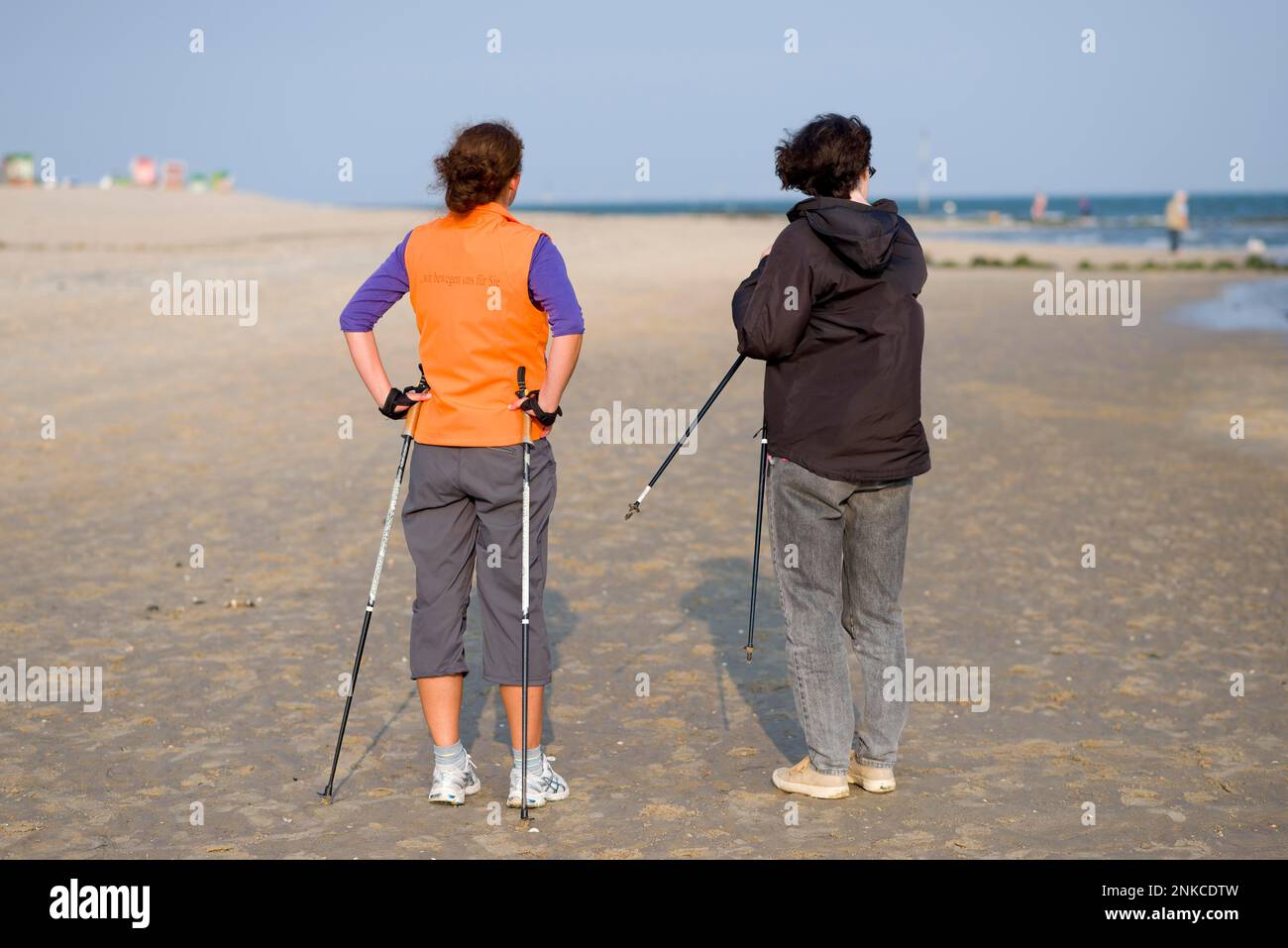 Two people walking on coast hi-res stock photography and images - Alamy