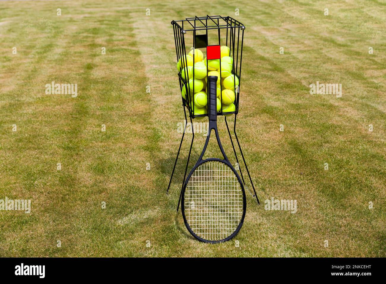 Ball Basket with Tennis Racket Stock Photo - Alamy