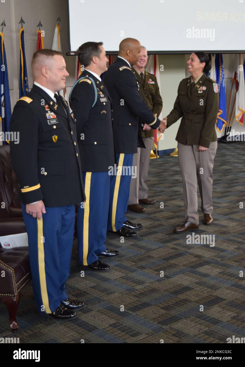 Second Lieutenant Rebekah Larsen receives congratulations from Col ...