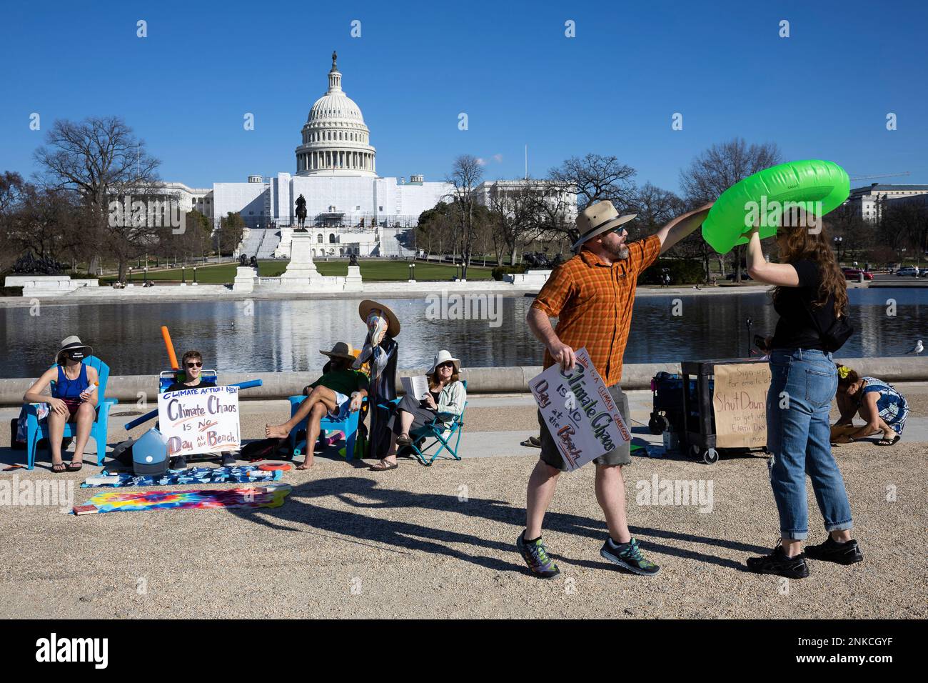 Patrick Young, an activist with the group ShutDownDC, puts a pool ...