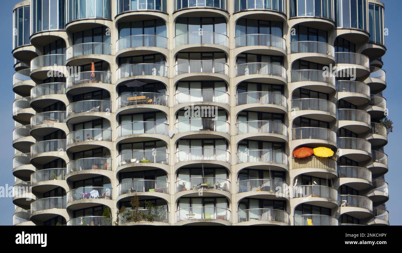 Two colourful parasols on the balcony of a high-rise building, Augsburg ...