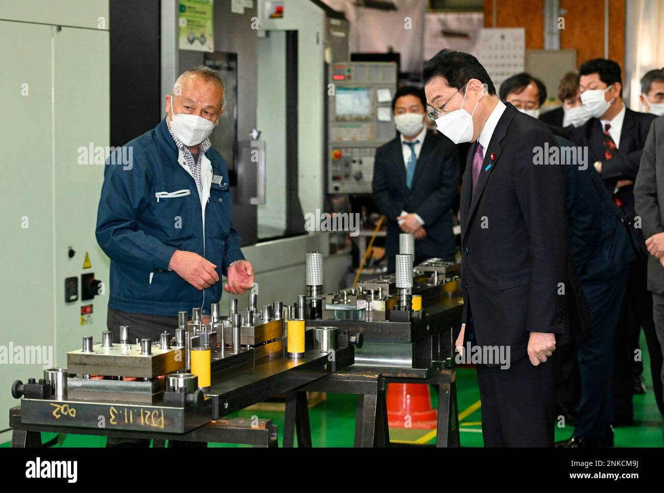 Japanese Prime Minister Fumio Kishida (front,R) visits Takeda Kanagata ...