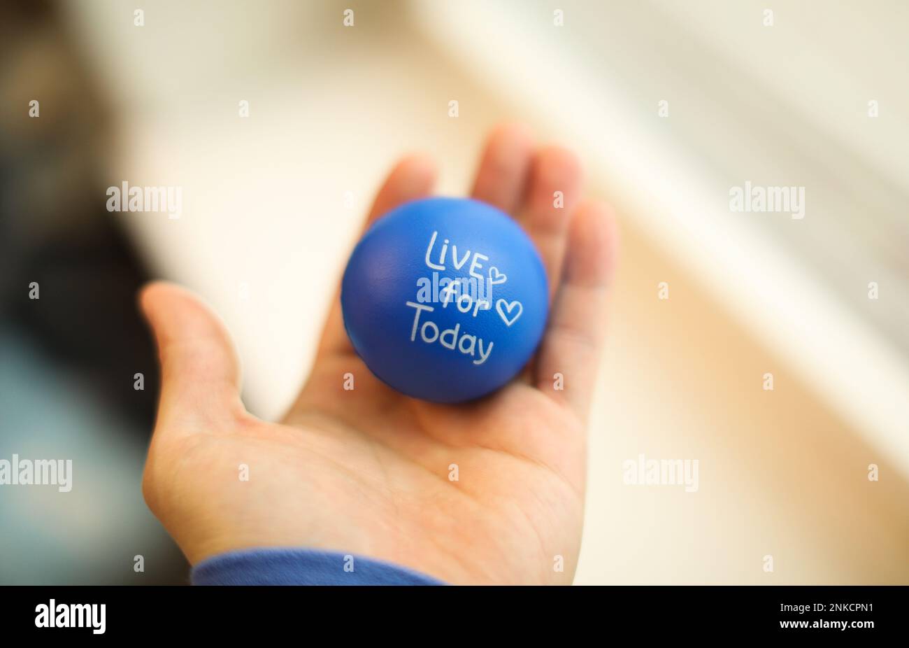 Stress Ball showing daily motivational messages stress less Stock Photo ...