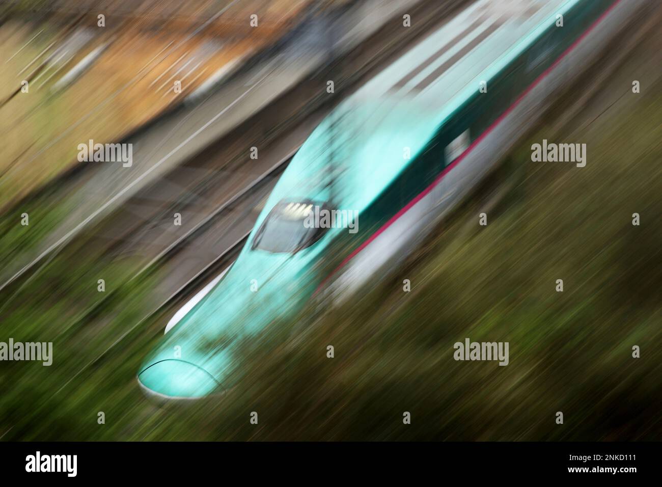 Tohoku Shinkansen bullet train passes an accident site that a train ...