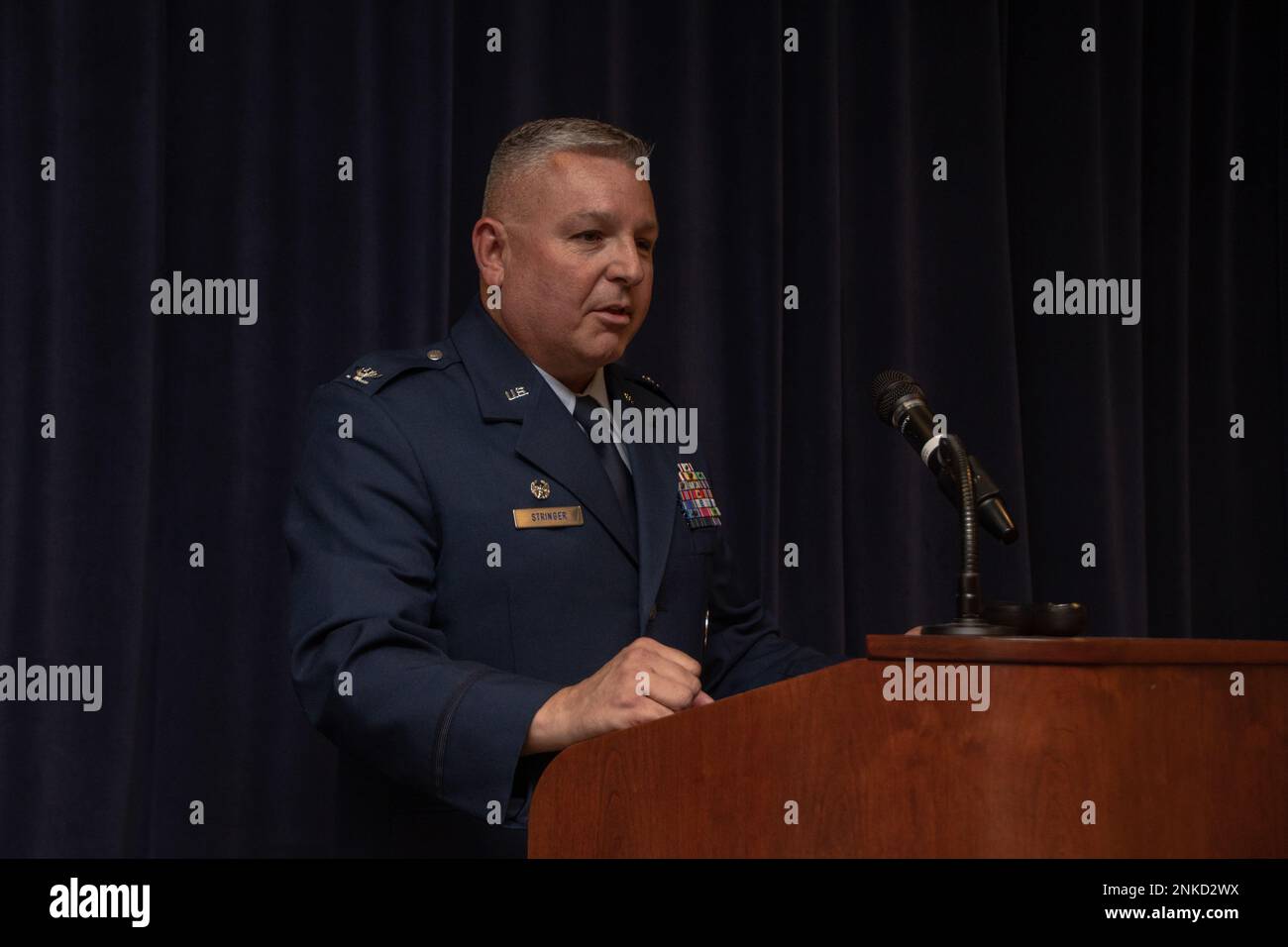 Col. Eric Stringer, 152nd Medical Group commander, speaks to friends ...