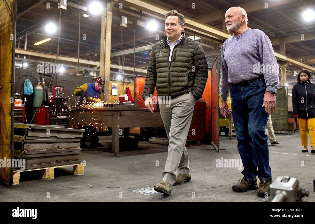 Republican U.S. Senate candidate Dave McCormick, left, walks with Peter ...