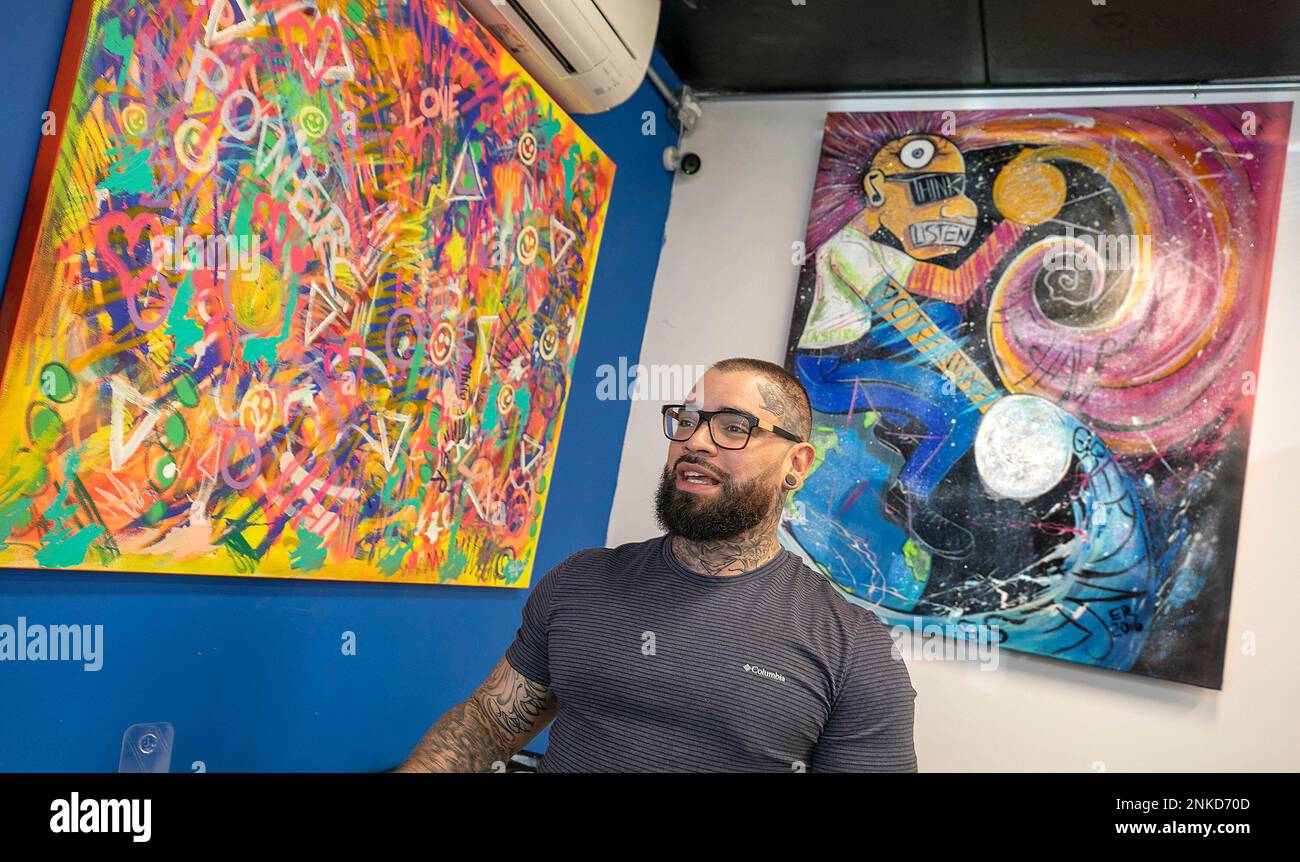 Barber Eddie Rivera talks about his artwork featured on the walls of ...