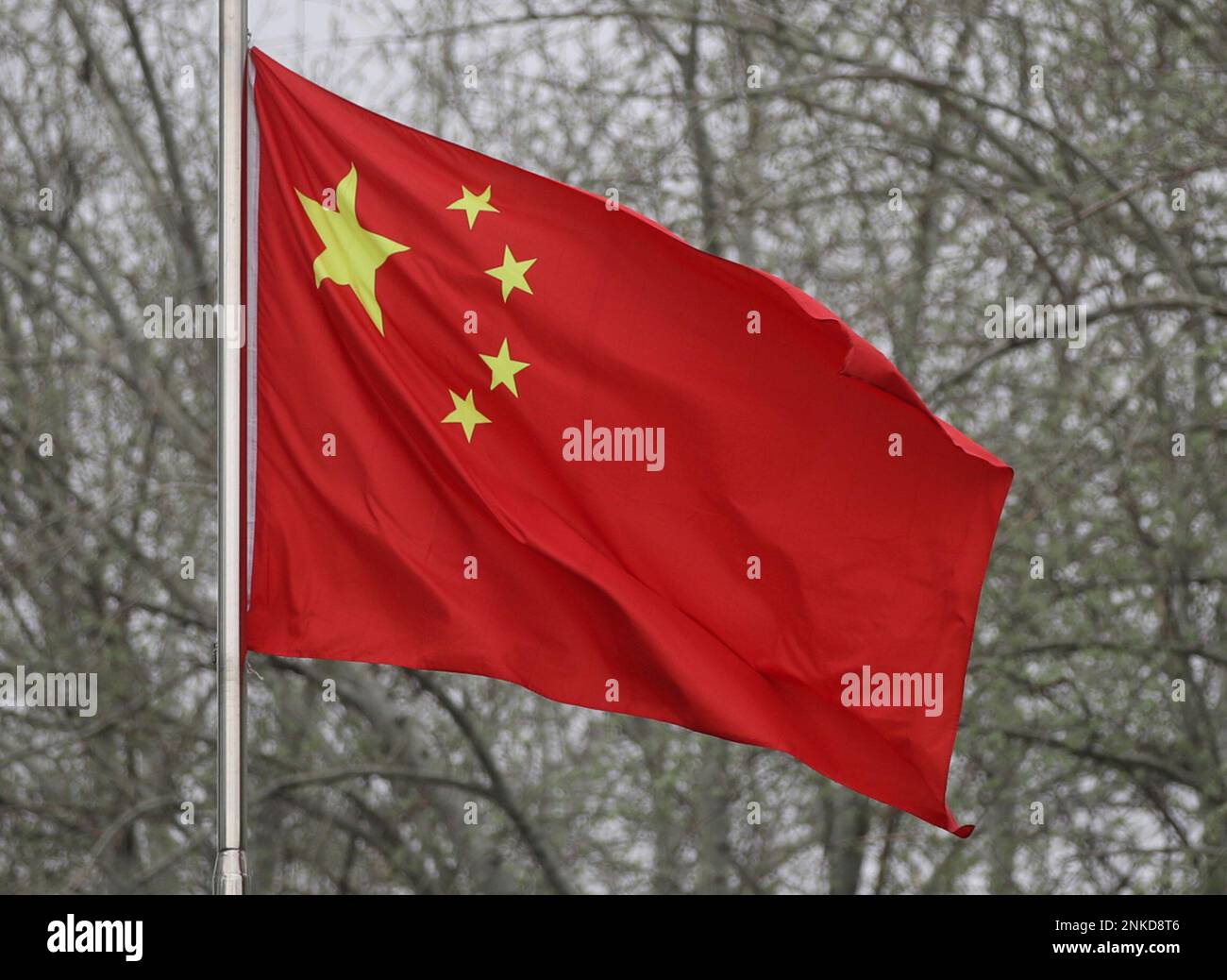 A China's national flag is raised at Ritan Park in Beijing, China on ...
