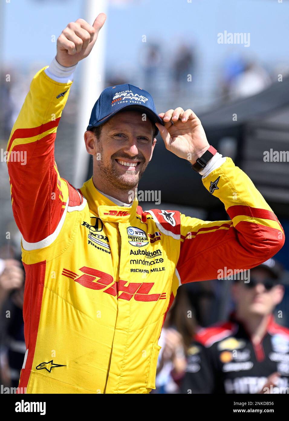 Second place finisher Romain Grosjean acknowledges the crowd in victory ...