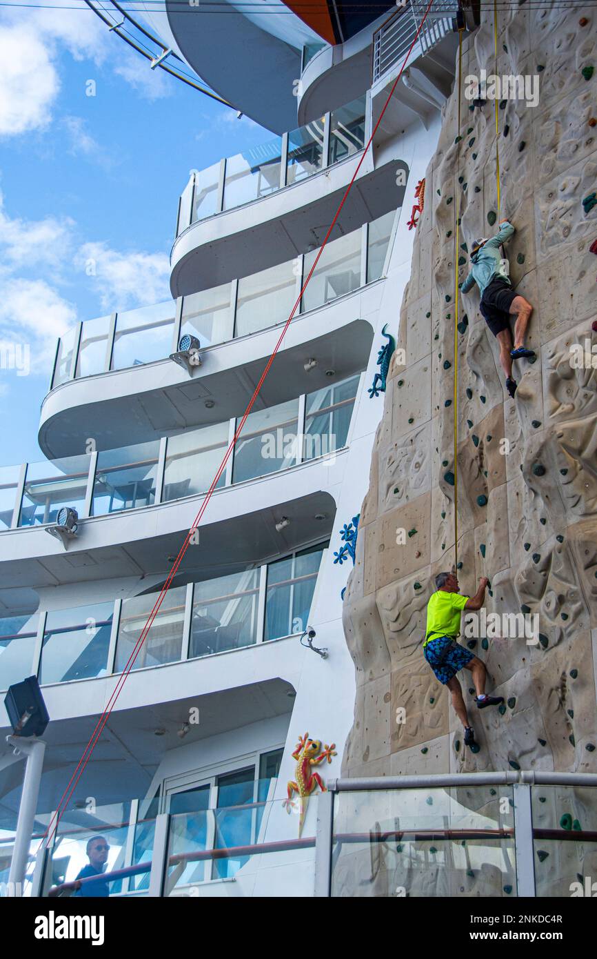 Two men rock climbing on board the Allure of the Seas, Royal Caribbean ...