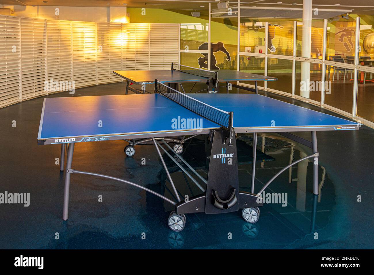 A pair of ping-pong tables in the sports area of the Allure of the Seas ...